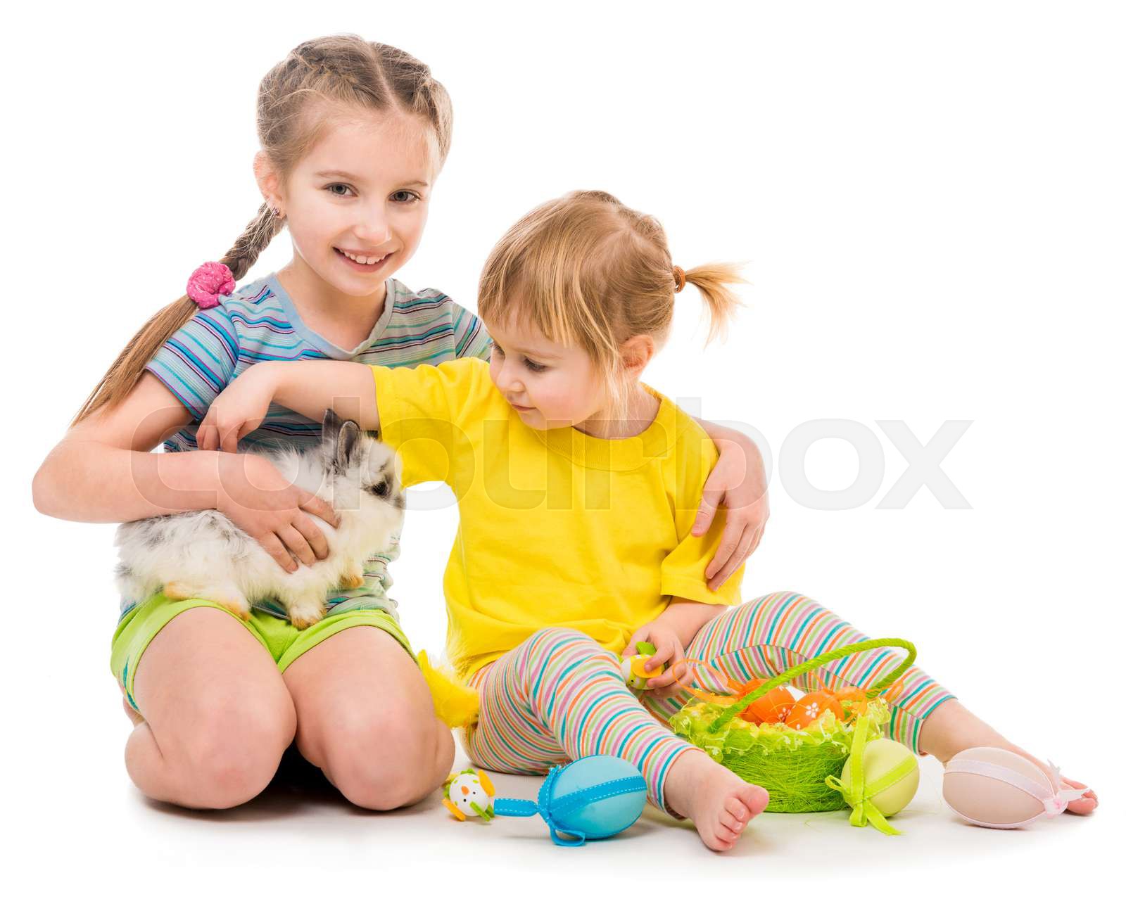 happy little sisters with her rabbit | Stock image | Colourbox