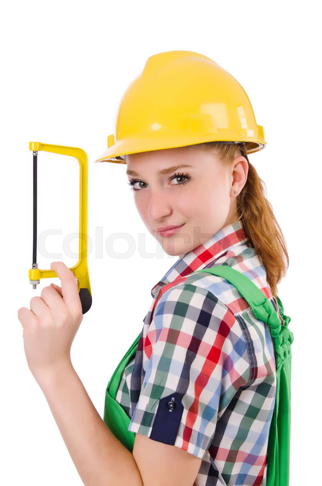 Female handyman in overalls isolated on white | Stock image | Colourbox