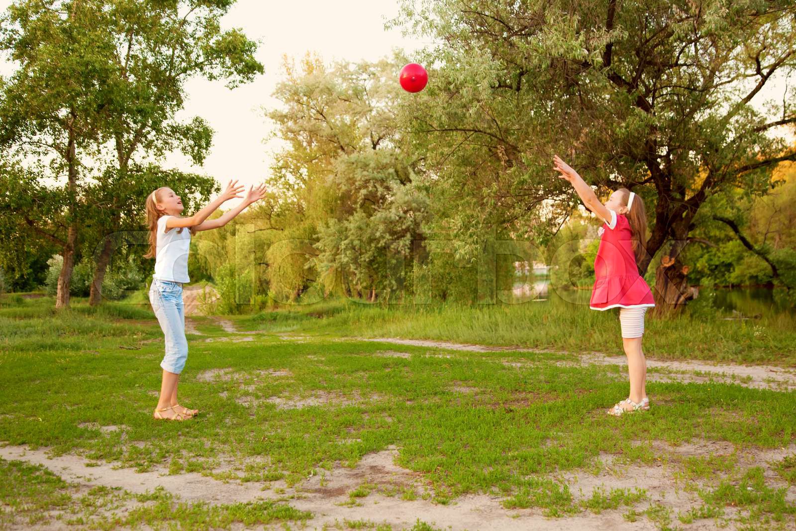 Kids playing in a suburban neighborhood. | Stock image | Colourbox