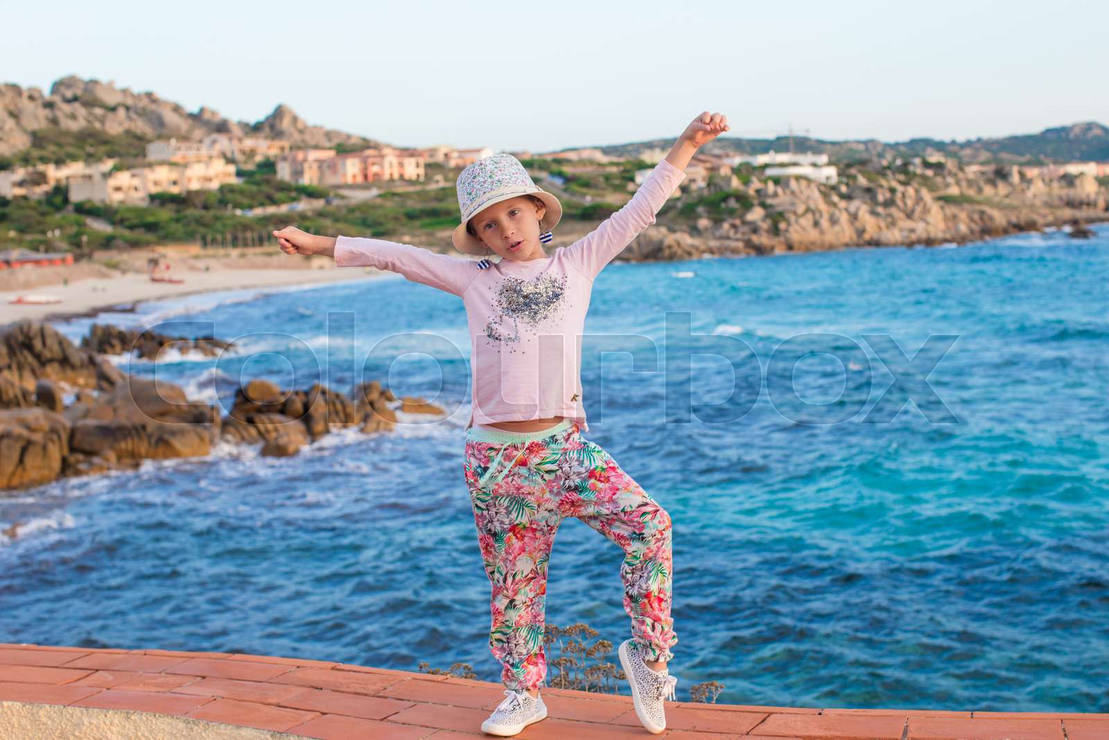 Adorable little girl have fun at tropical beach | Stock image | Colourbox