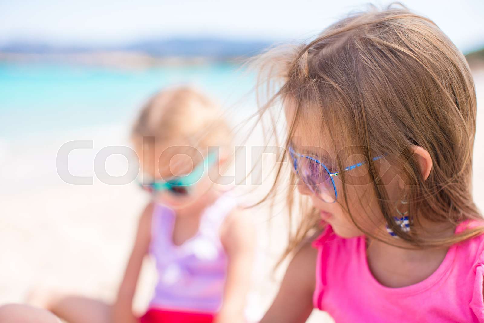 Adorable little girls at beach during summer vacation | Stock image ...