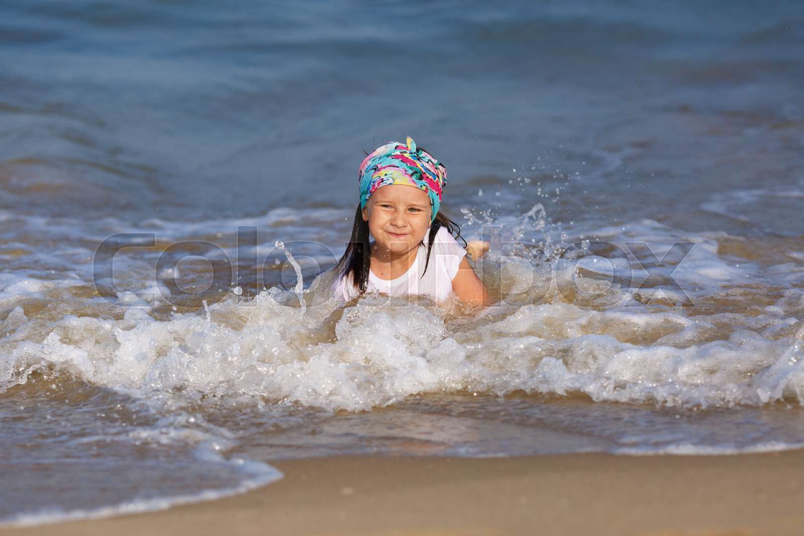 Baby in water | Stock image | Colourbox