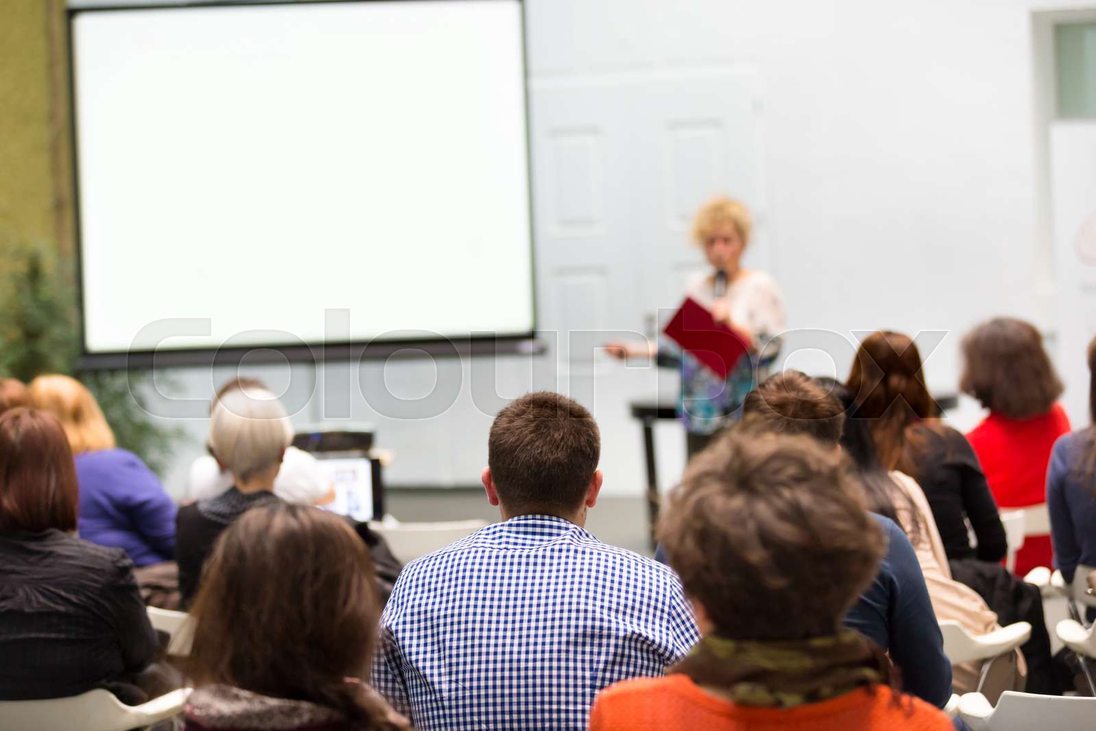 Woman lecturing at university. | Stock image | Colourbox