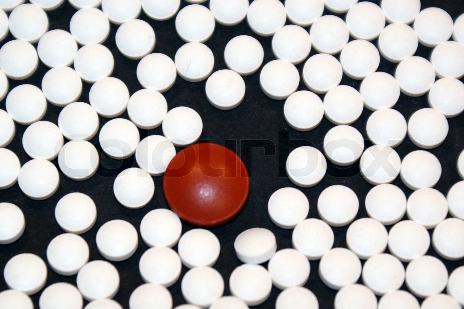 The big red pill and the many white pills. | Stock image | Colourbox