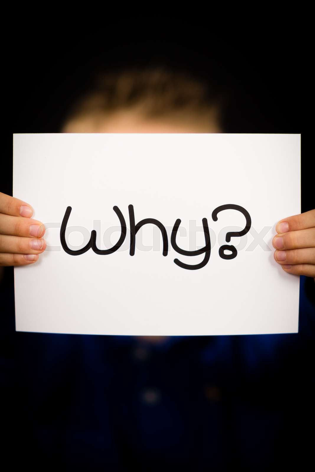 Child holding Why sign | Stock image | Colourbox