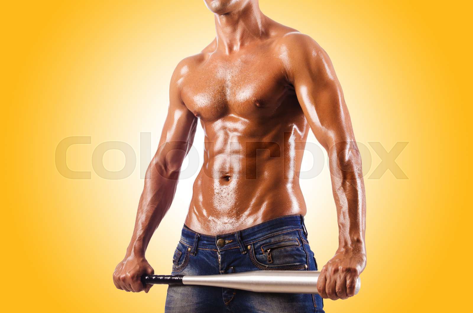 Muscular man with baseball bat | Stock image | Colourbox