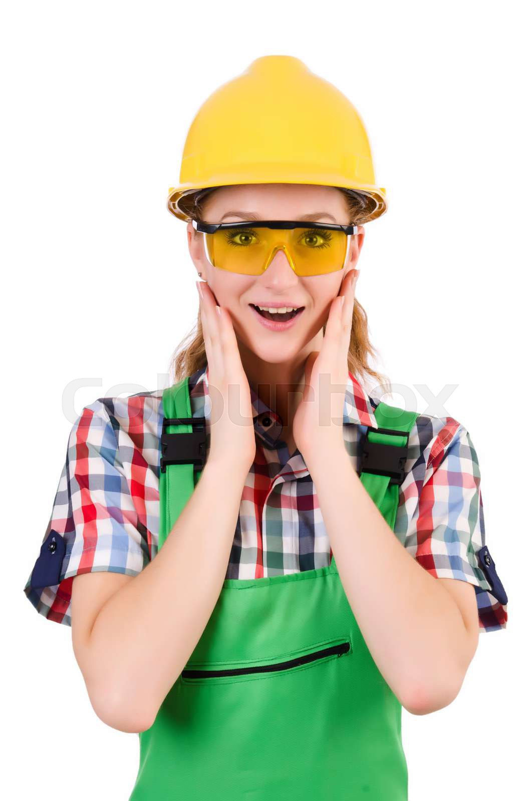 Female handyman in overalls isolated on white | Stock image | Colourbox