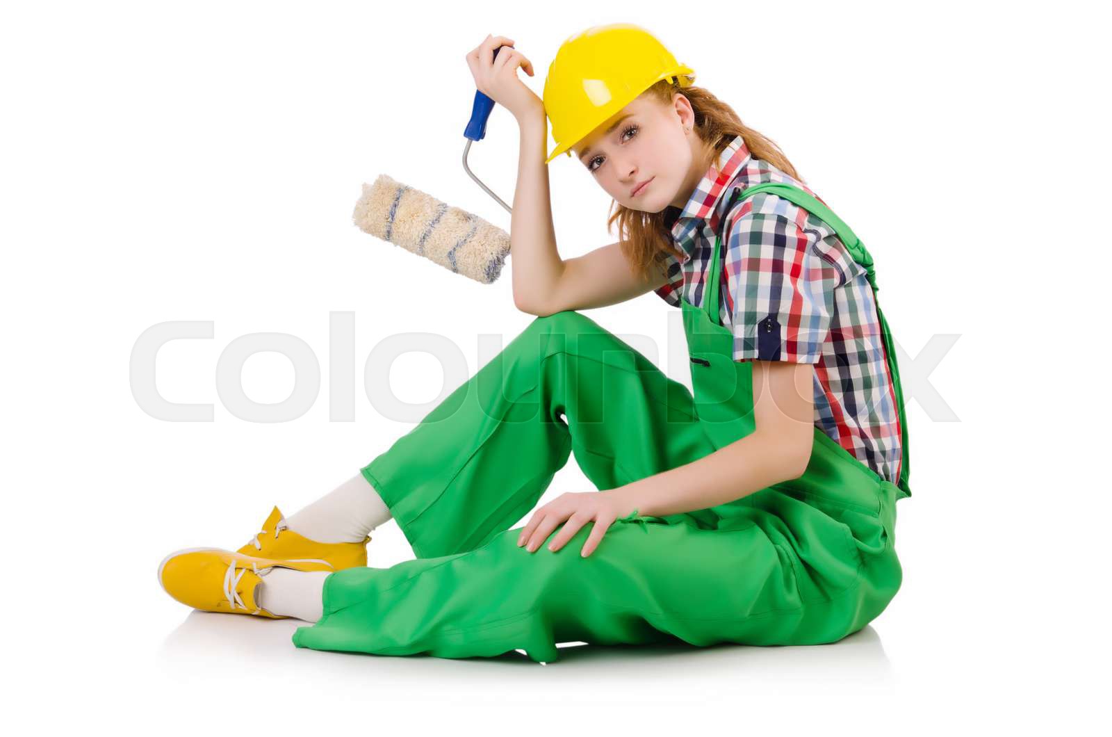 Female handyman in overalls isolated on white | Stock image | Colourbox