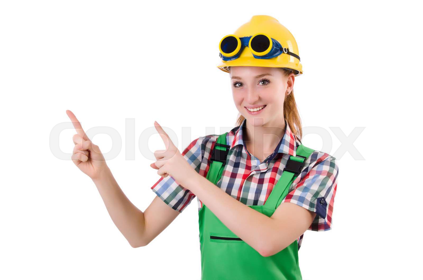 Female handyman in overalls isolated on white | Stock image | Colourbox