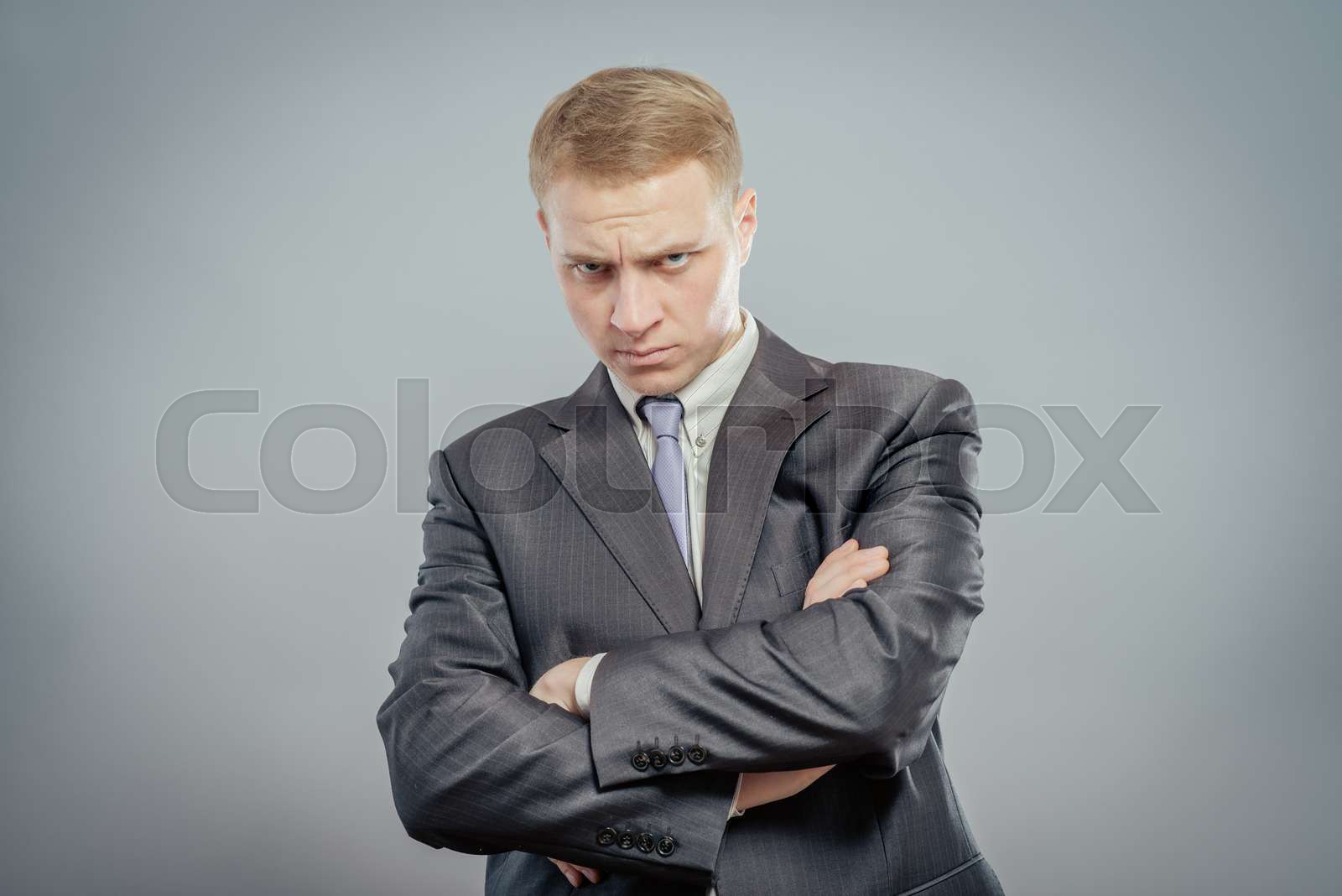 angry with arms crossed on his chest | Stock image | Colourbox