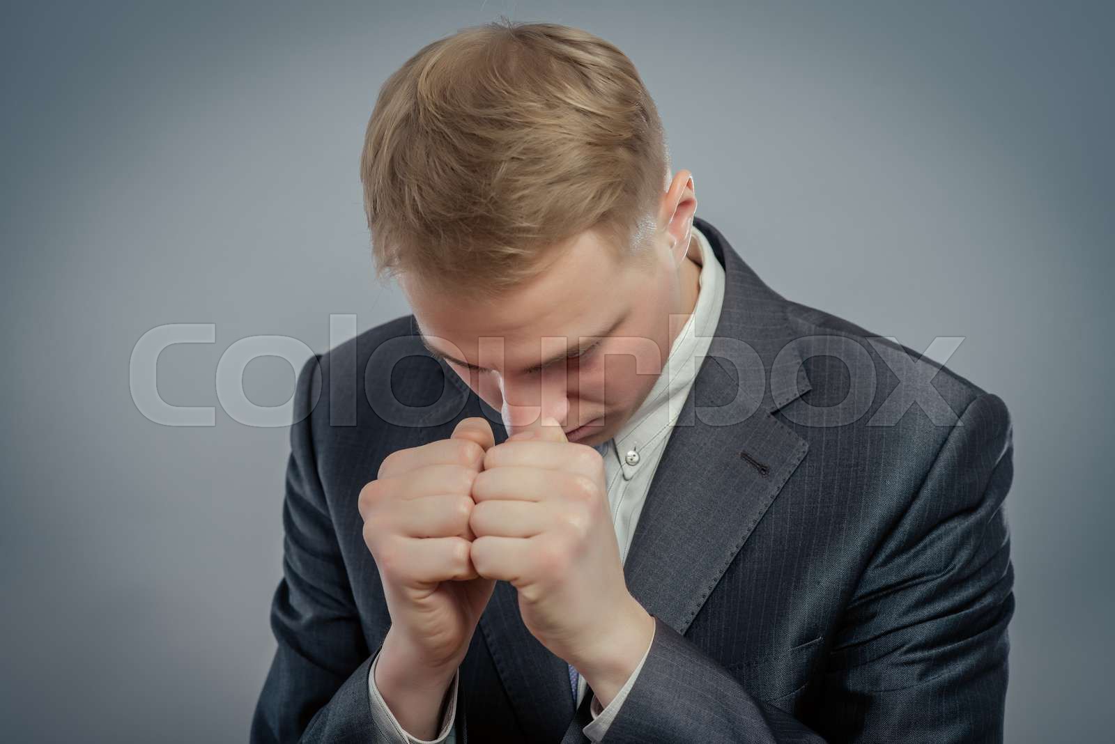 Closeup portrait of a young man praying | Stock image | Colourbox
