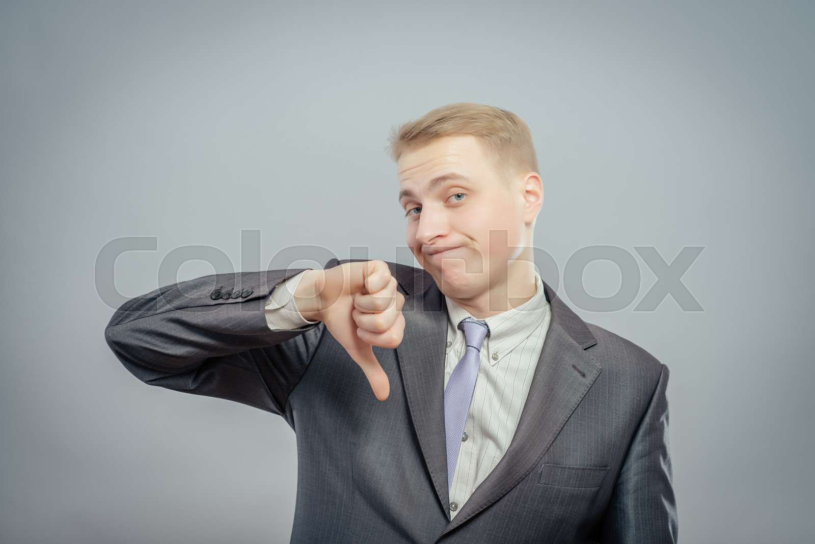 A businessman expressing his opinion on something in a negative way ...