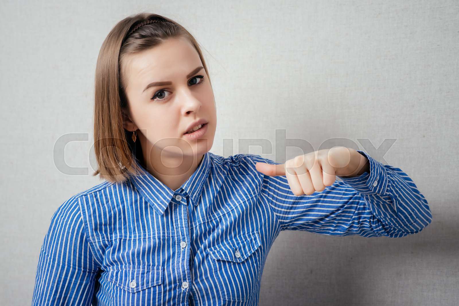 girl gets angry and showing gesture. | Stock image | Colourbox