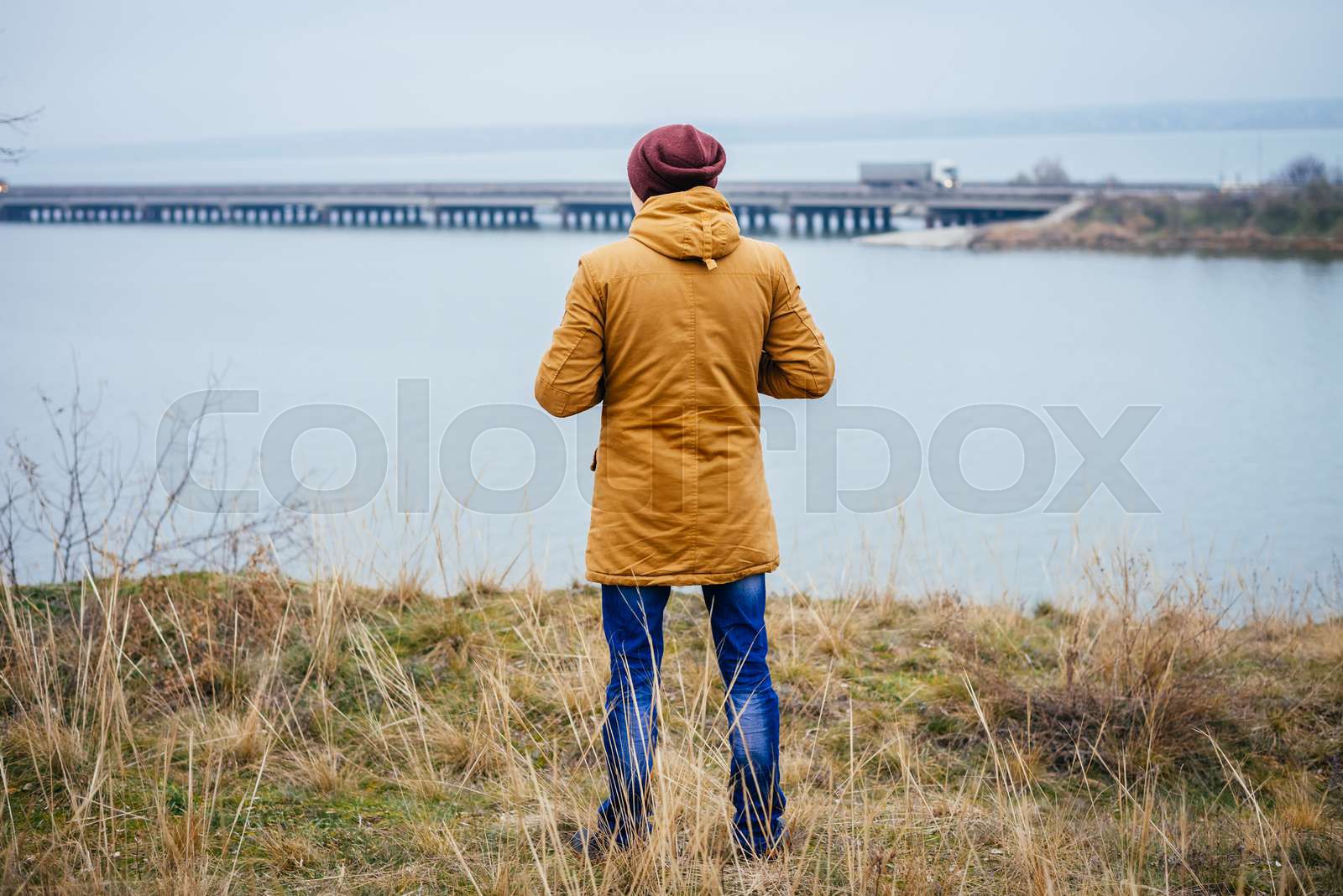 man standing on the river bank | Stock image | Colourbox