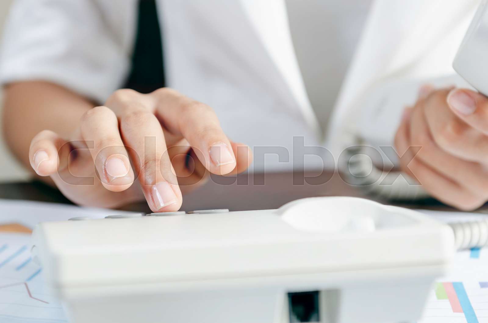 Dialling on a telephone | Stock image | Colourbox