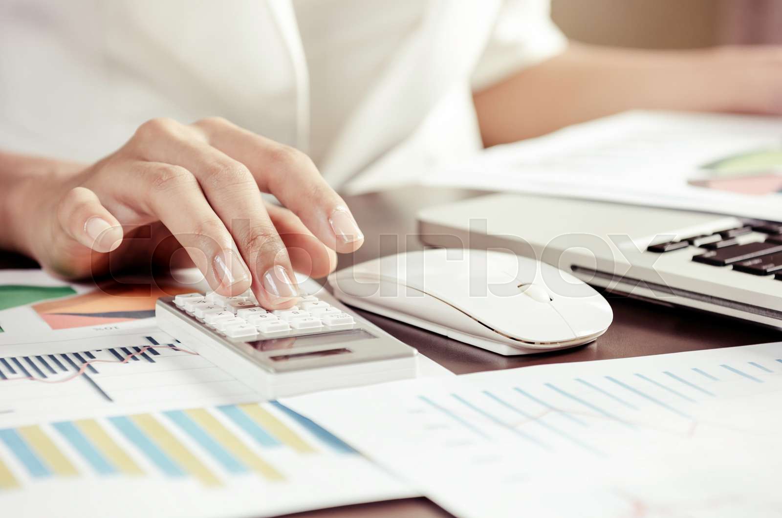 Working with calculator | Stock image | Colourbox