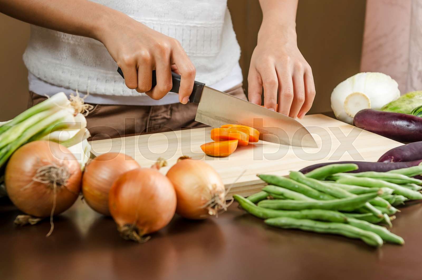 woman cutting vegetables | Stock image | Colourbox