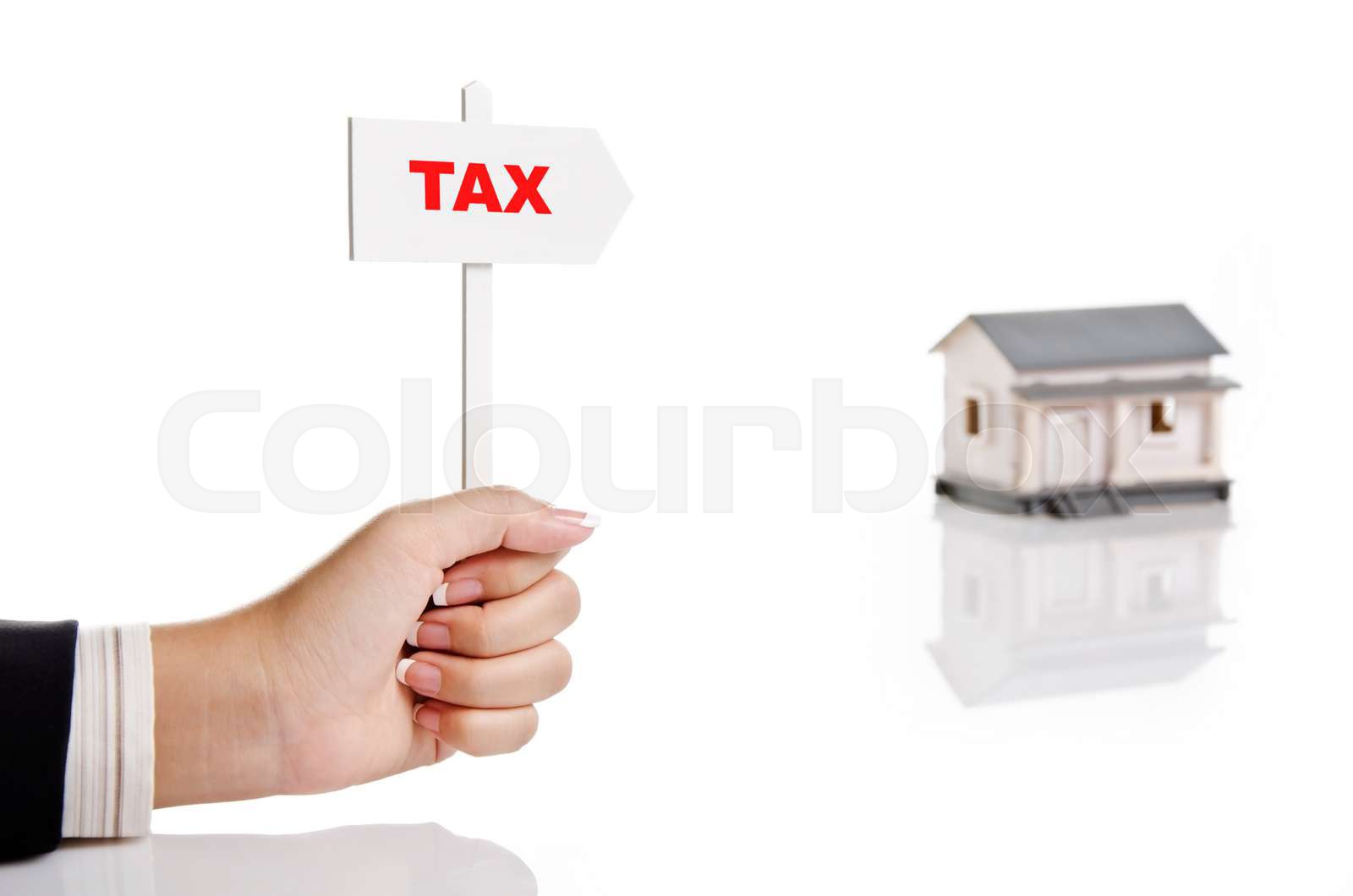 holding tax sign | Stock image | Colourbox