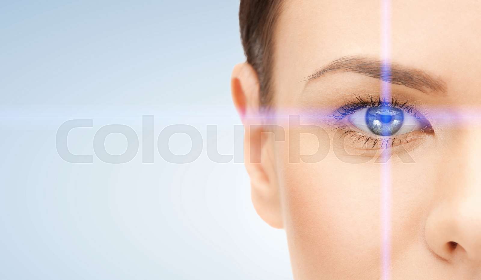 beautiful woman pointing to eye | Stock image | Colourbox