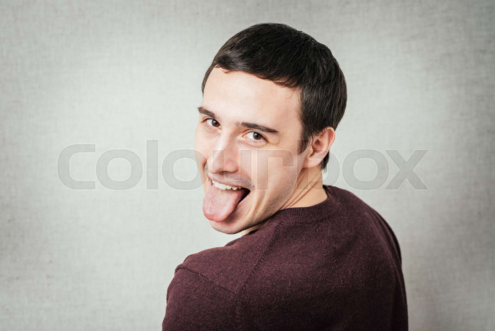 man shows tongue | Stock image | Colourbox