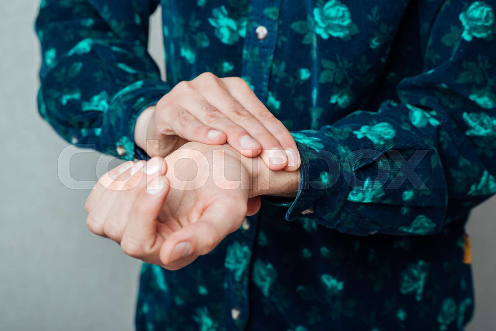 human hand measuring arm pulse | Stock image | Colourbox
