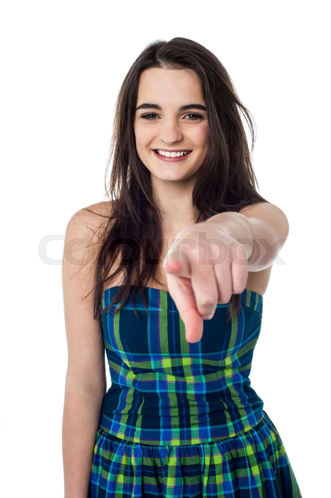 Stylish teen girl indicating forward | Stock image | Colourbox