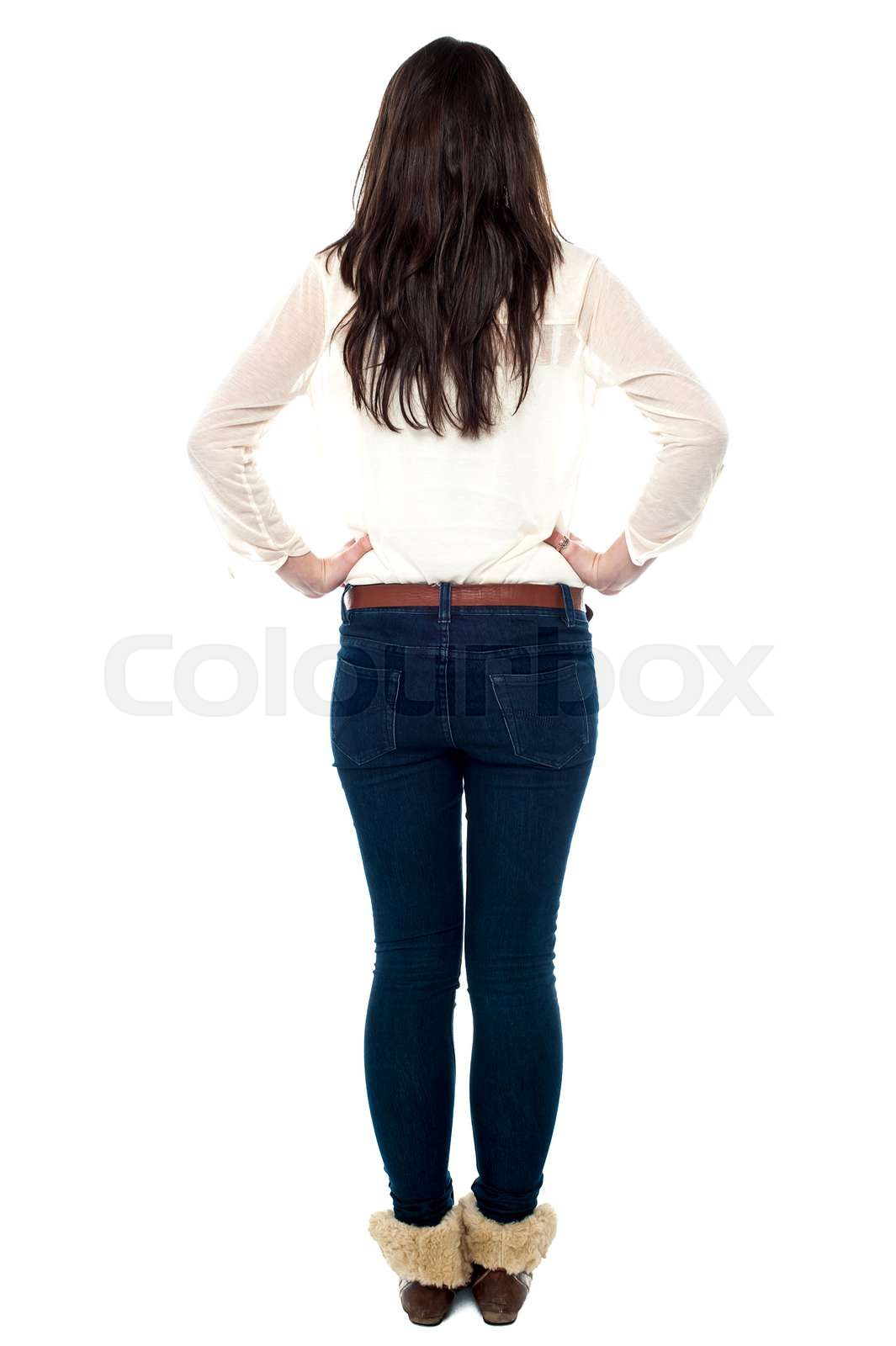 Back pose of a girl with hands on hip | Stock image | Colourbox