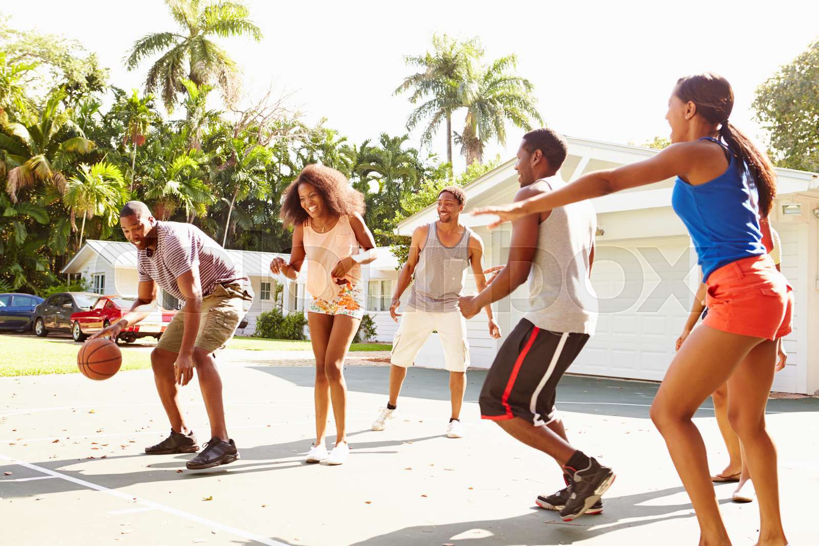 Group Of Young Friends Playing Basketball Match | Stock image | Colourbox
