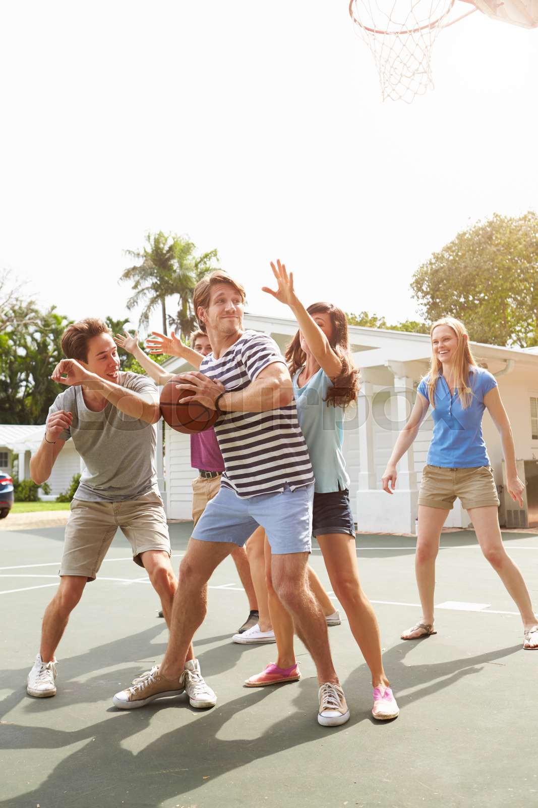 Group Of Young Friends Playing Basketball Match | Stock image | Colourbox