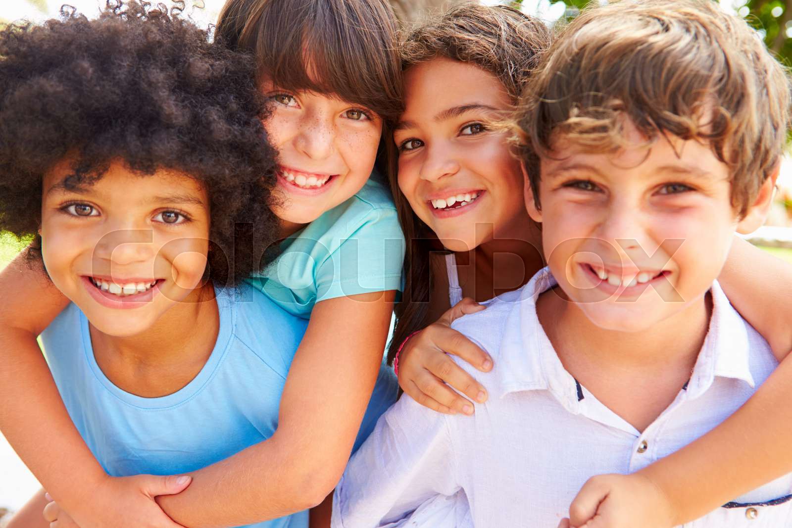 Group Of Children Giving Each Other Piggyback Rides | Stock image ...