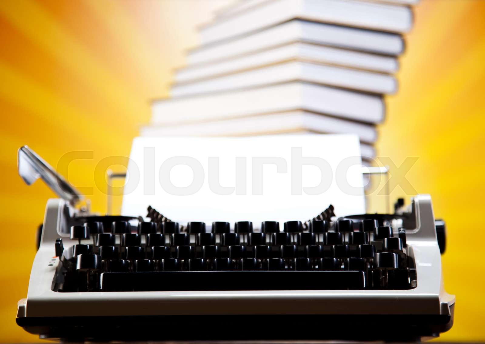 Typewriter and a blank sheet of paper | Stock image | Colourbox