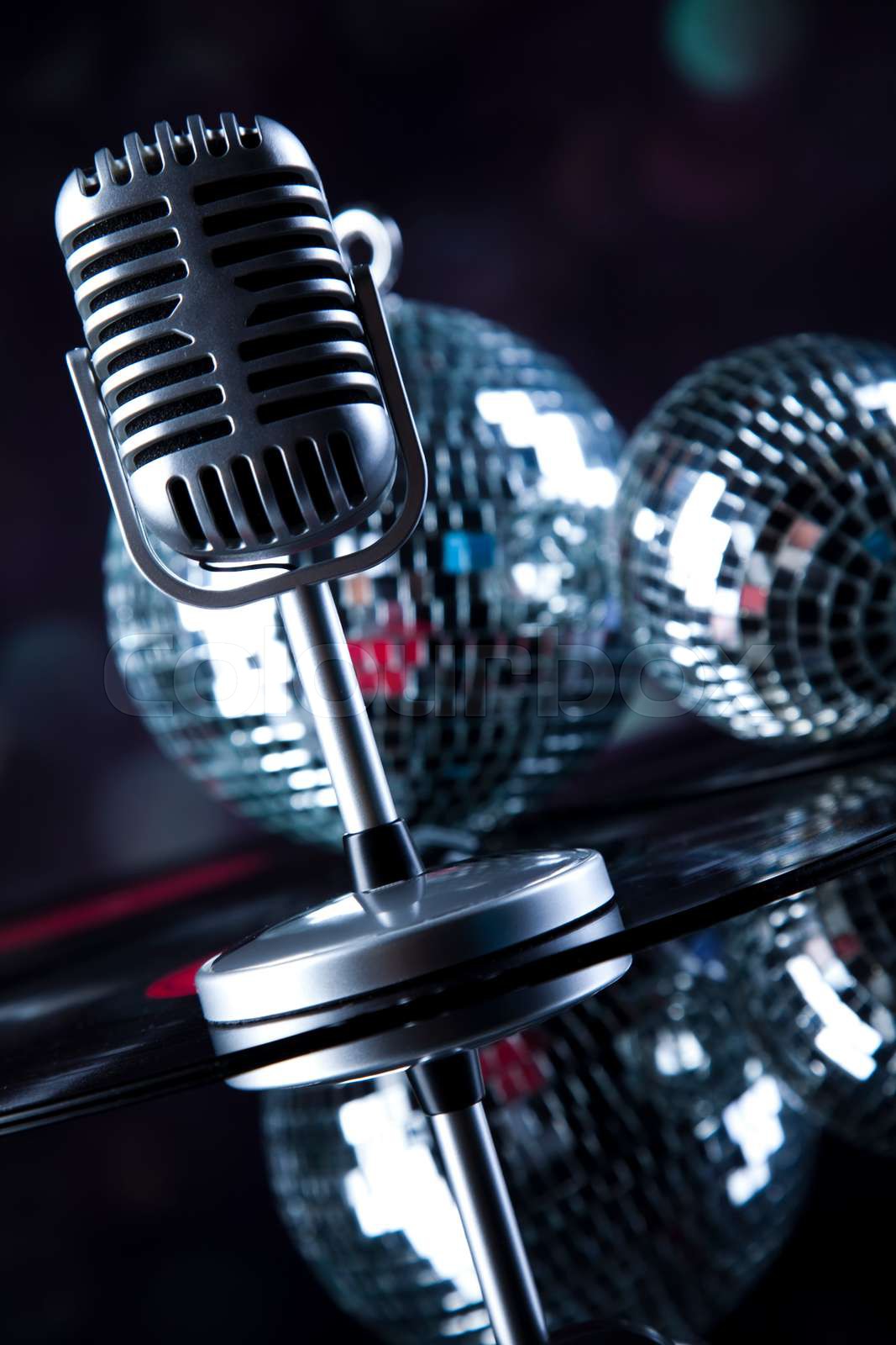 Microphone, vinyl record and Disco Balls, music saturated concept ...