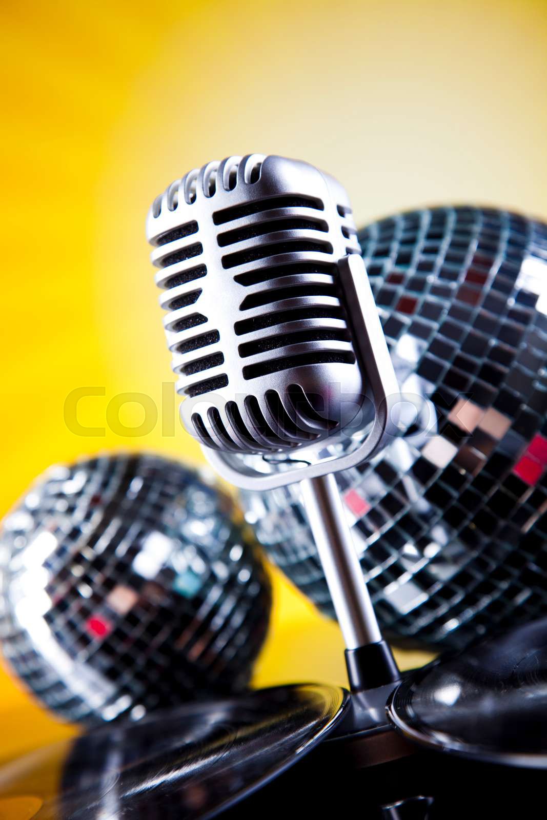 Microphone, vinyl record and Disco Balls, music saturated concept ...