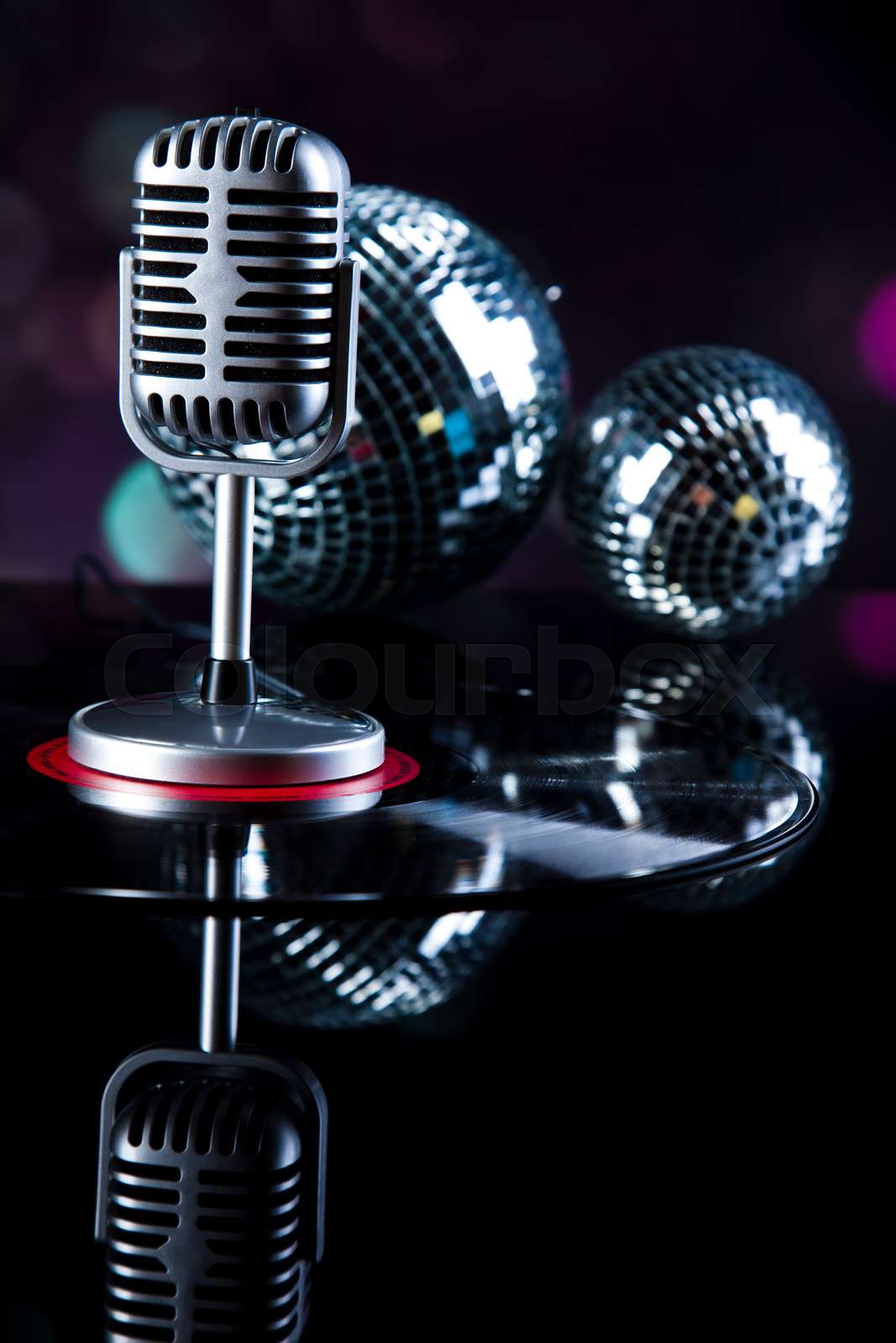 Microphone, vinyl record and Disco Balls, music saturated concept ...