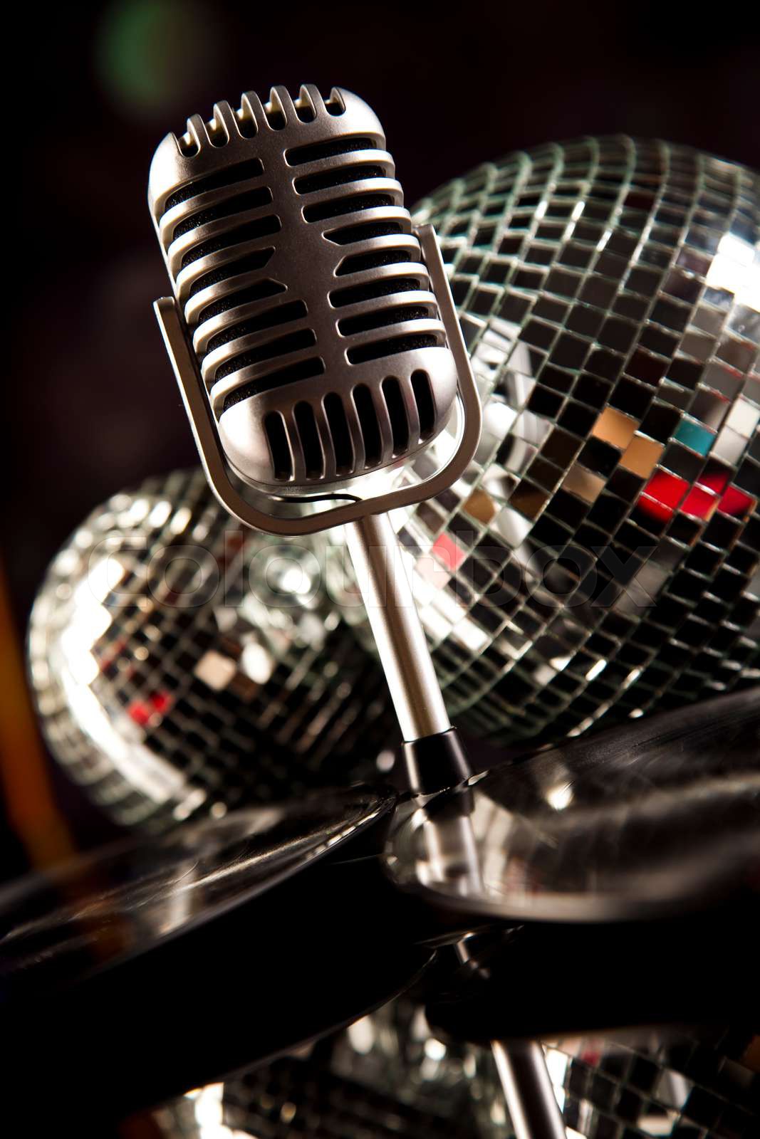 Microphone, vinyl record and Disco Balls, music saturated concept ...