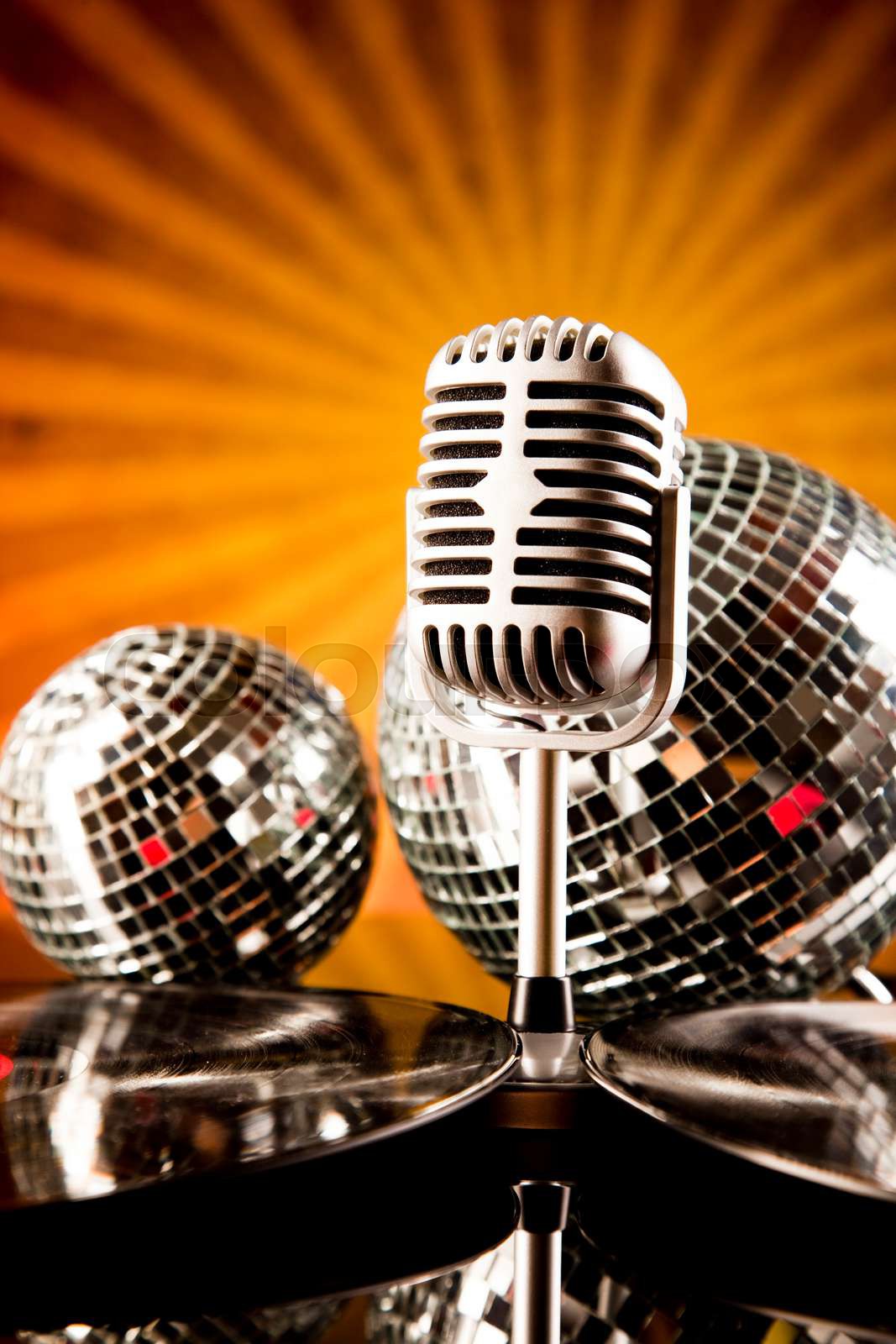 Microphone, vinyl record and Disco Balls, music saturated concept ...