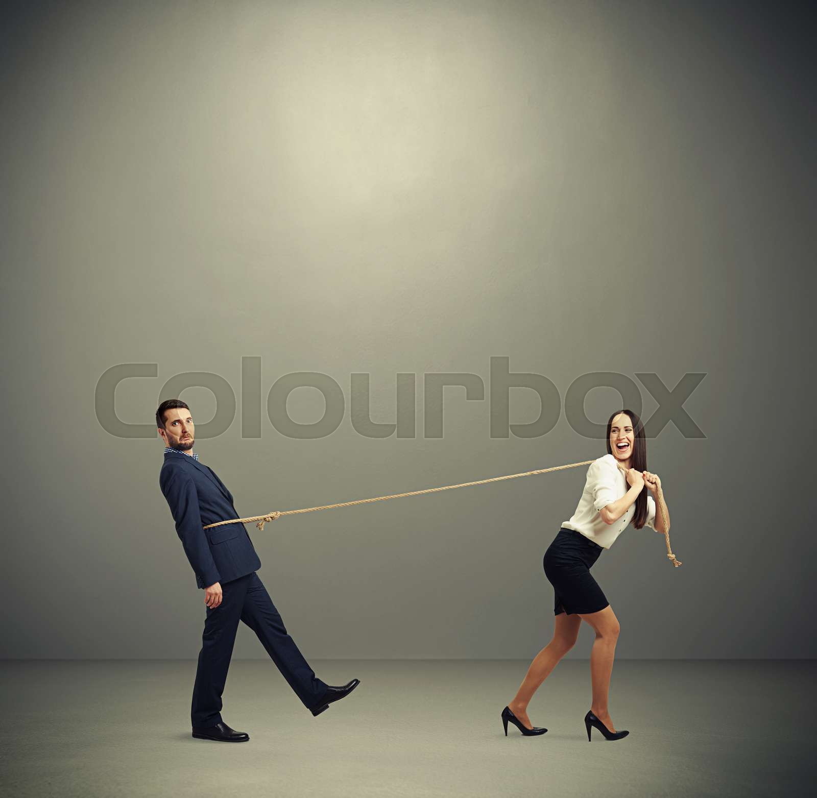 happy laughing woman pulling man | Stock image | Colourbox