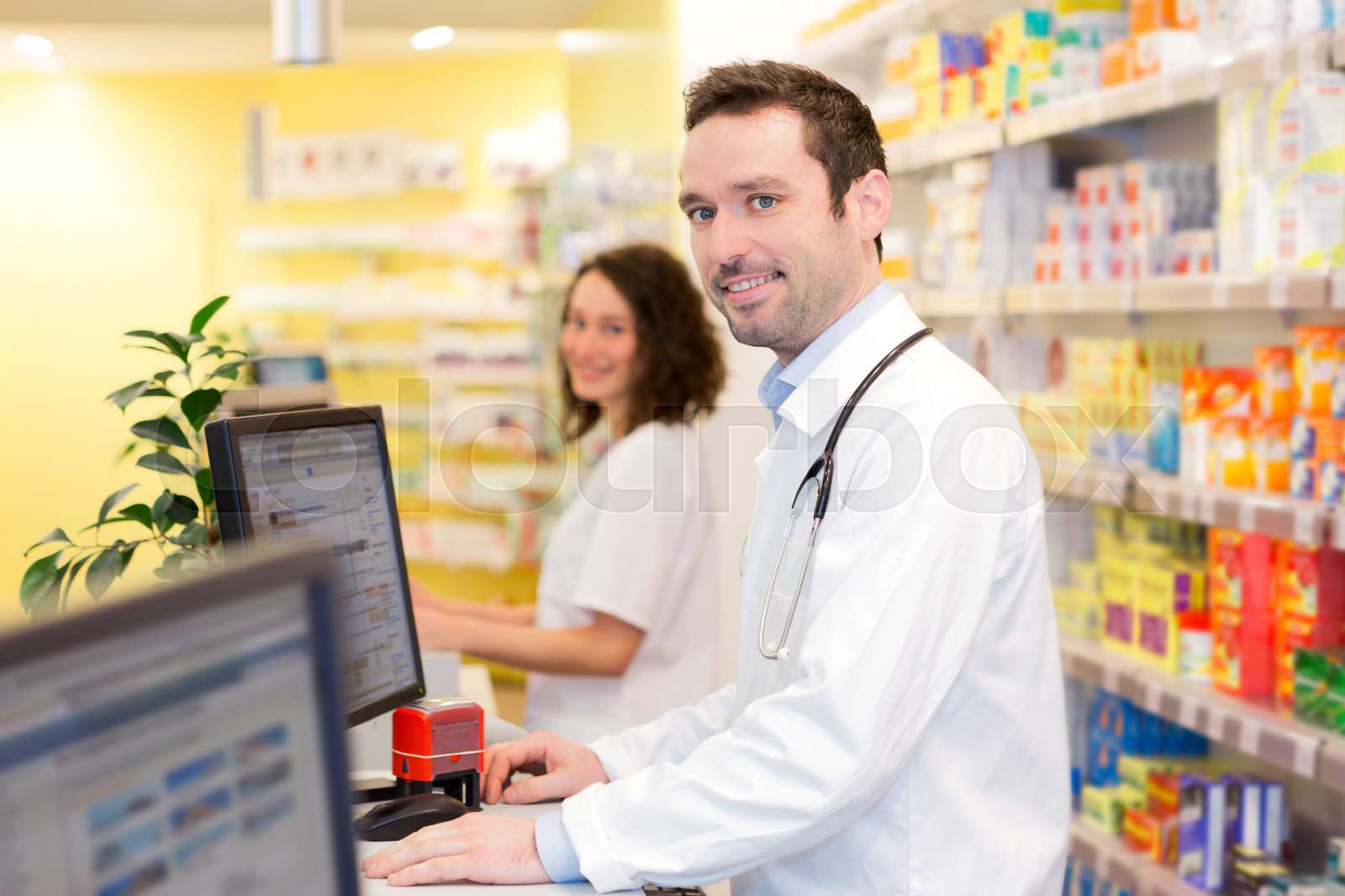 Portrait of an attractive pharmacist team at work | Stock image | Colourbox