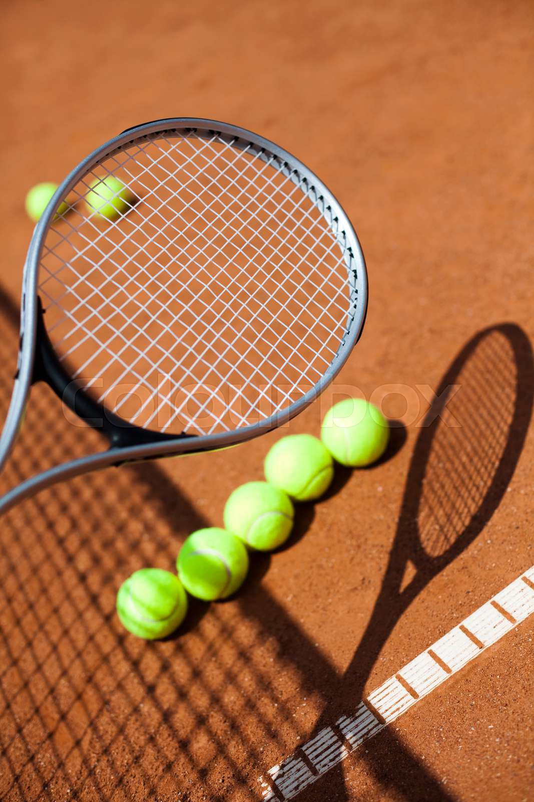 Tennis racket and balls, court | Stock image | Colourbox
