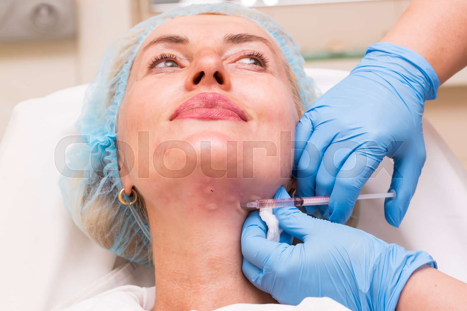 Cosmetic treatment with injection in a clinic | Stock image | Colourbox