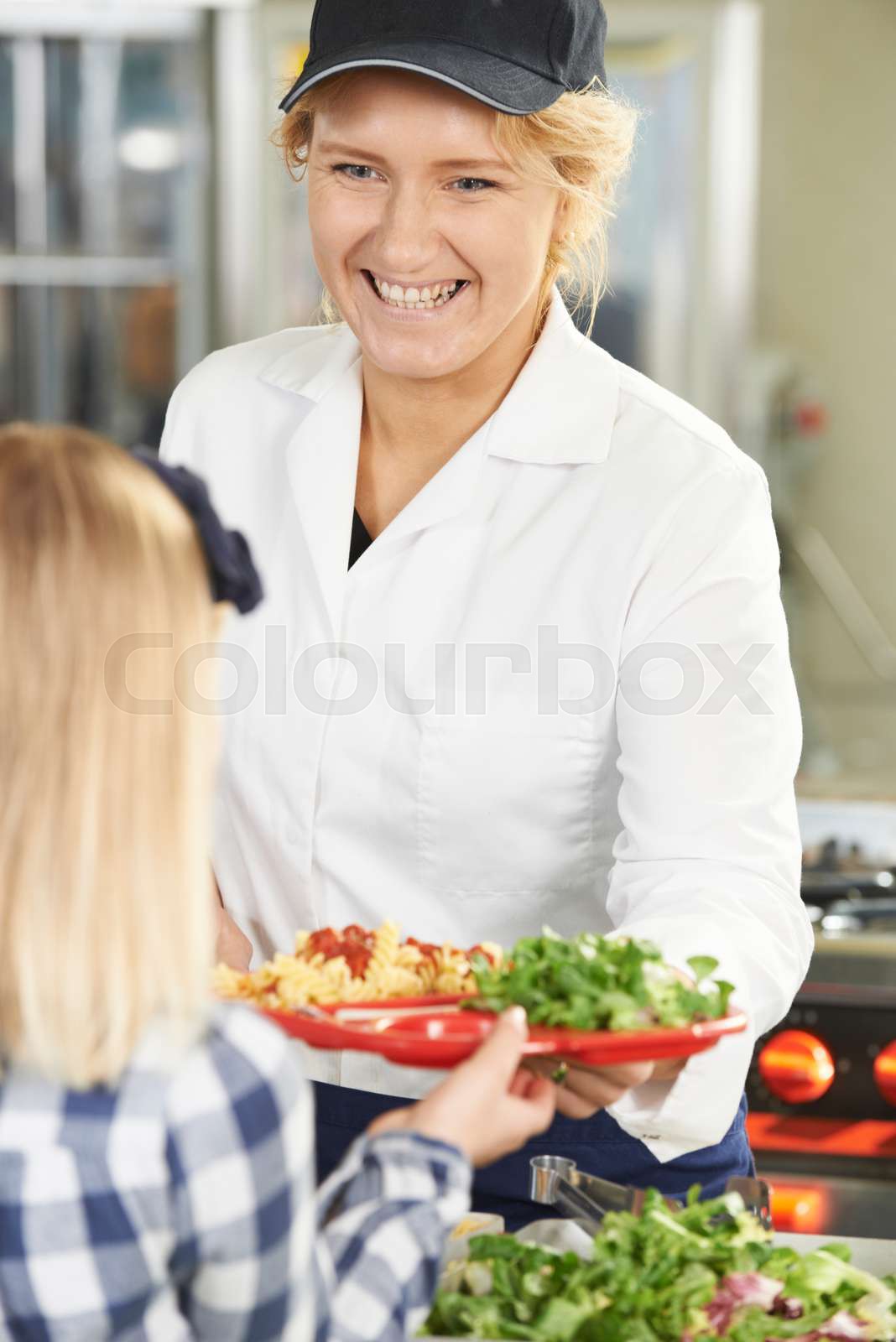 Pupil In School Cafeteria Being Served Lunch By Dinner Lady | Stock ...
