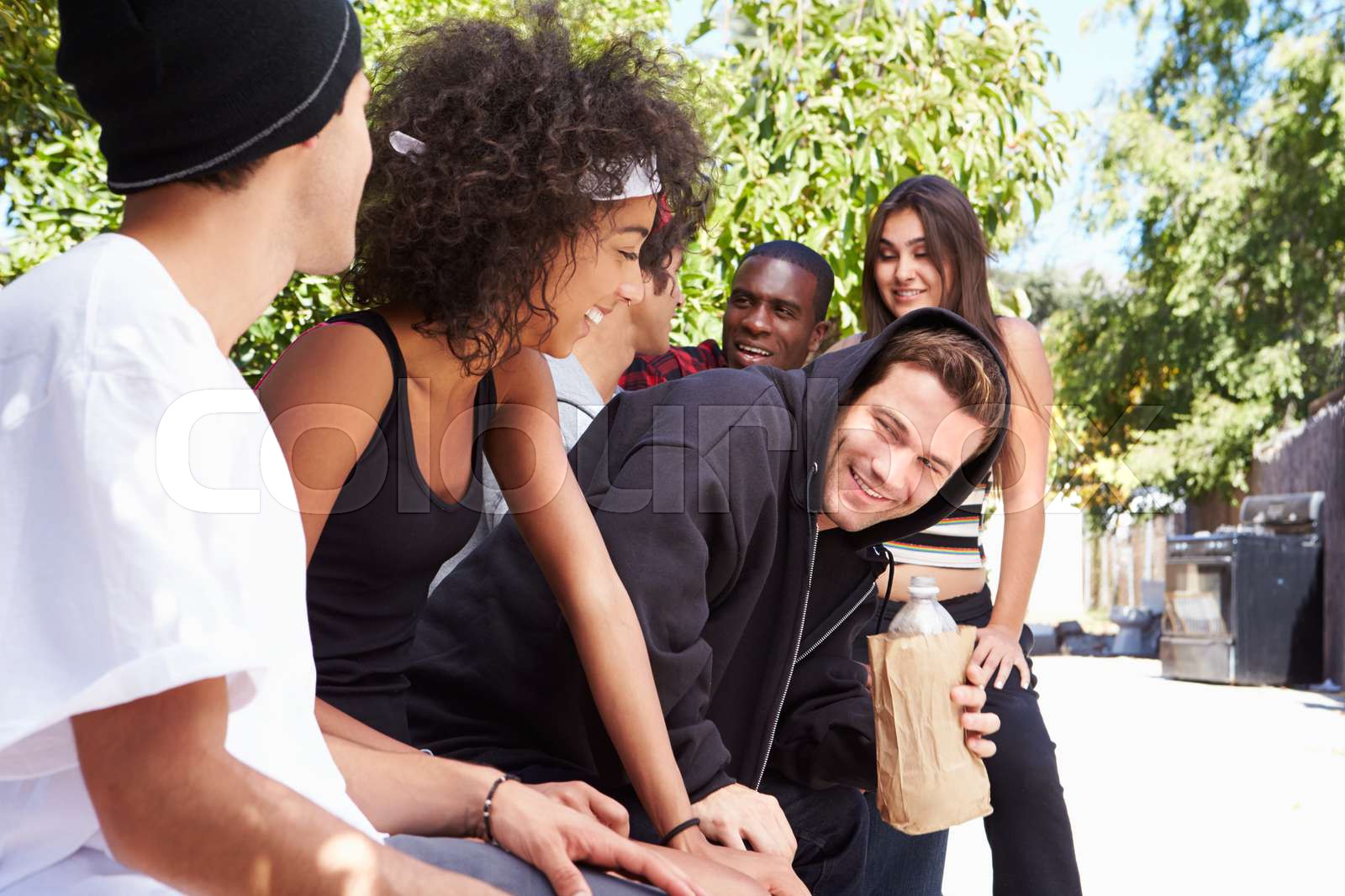 Gang Of Young People In Urban Setting Drinking Alcohol | Stock image ...