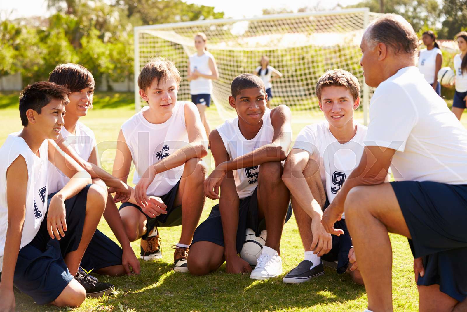 Coach Giving Team Talk To Male High School Soccer Team | Stock image ...
