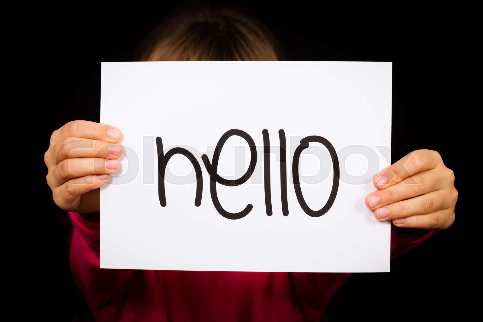 Child holding Hello sign | Stock image | Colourbox