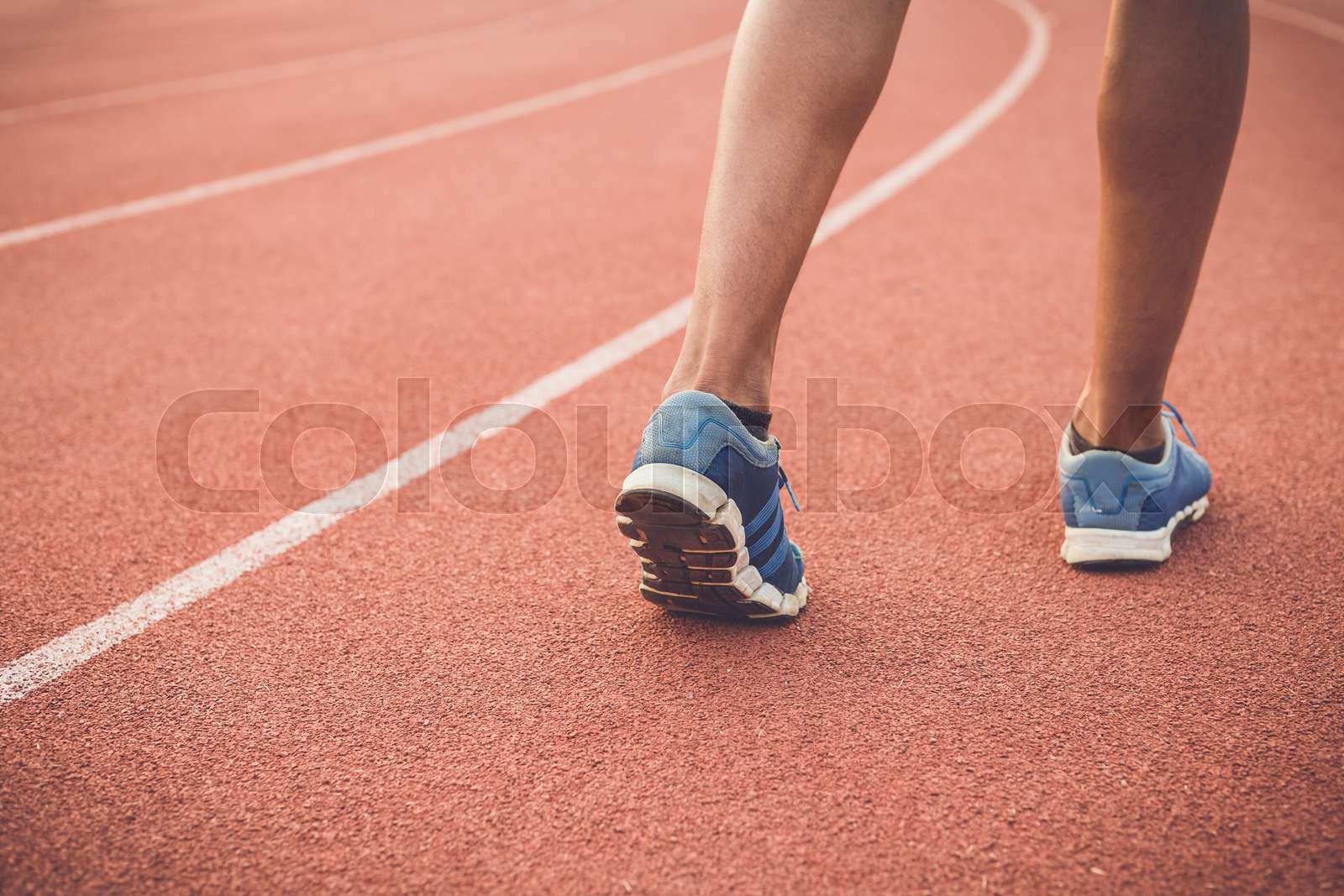 Runner feet on running stadium | Stock image | Colourbox