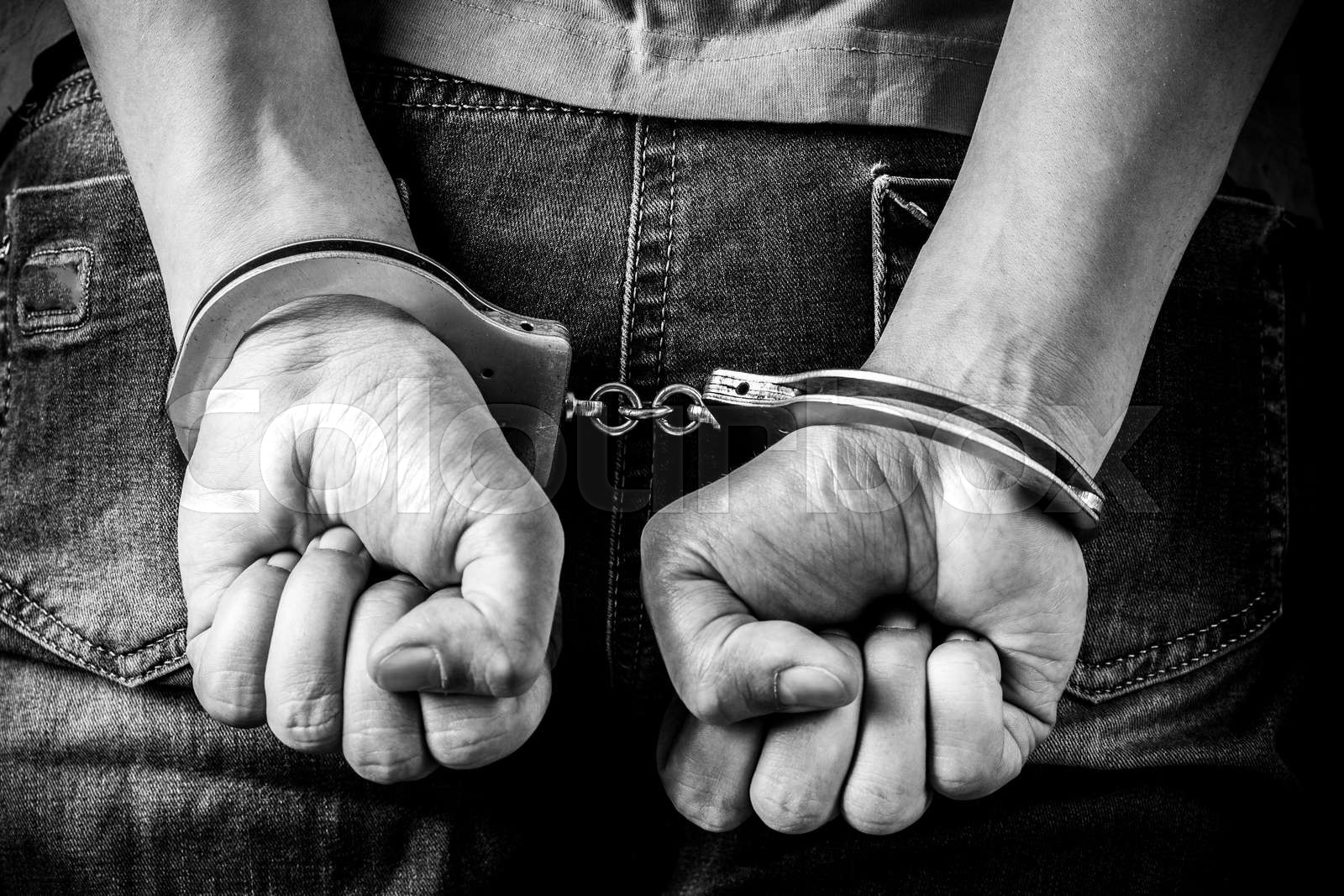 man hands in handcuffs | Stock image | Colourbox