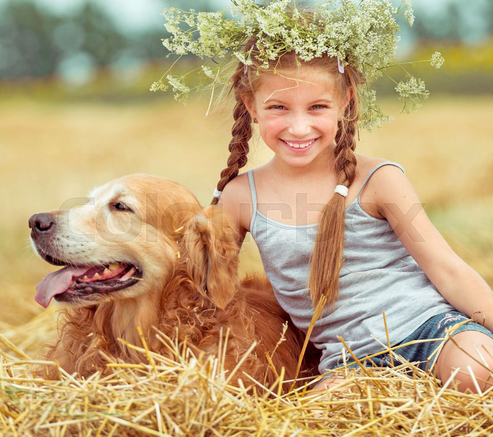 happy little girl with her dog | Stock image | Colourbox