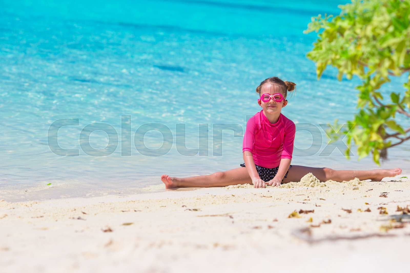 Adorable little girl at beach during summer vacation | Stock image ...