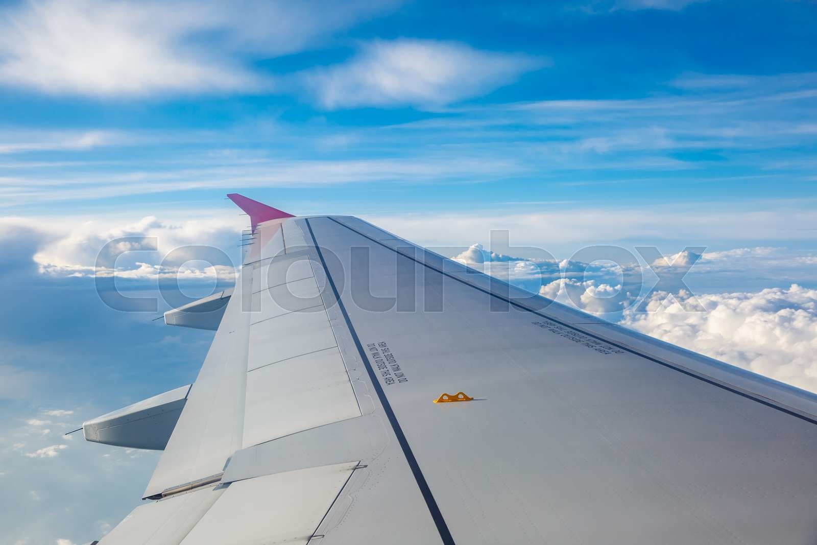 Looking through window aircraft during flight. | Stock image | Colourbox