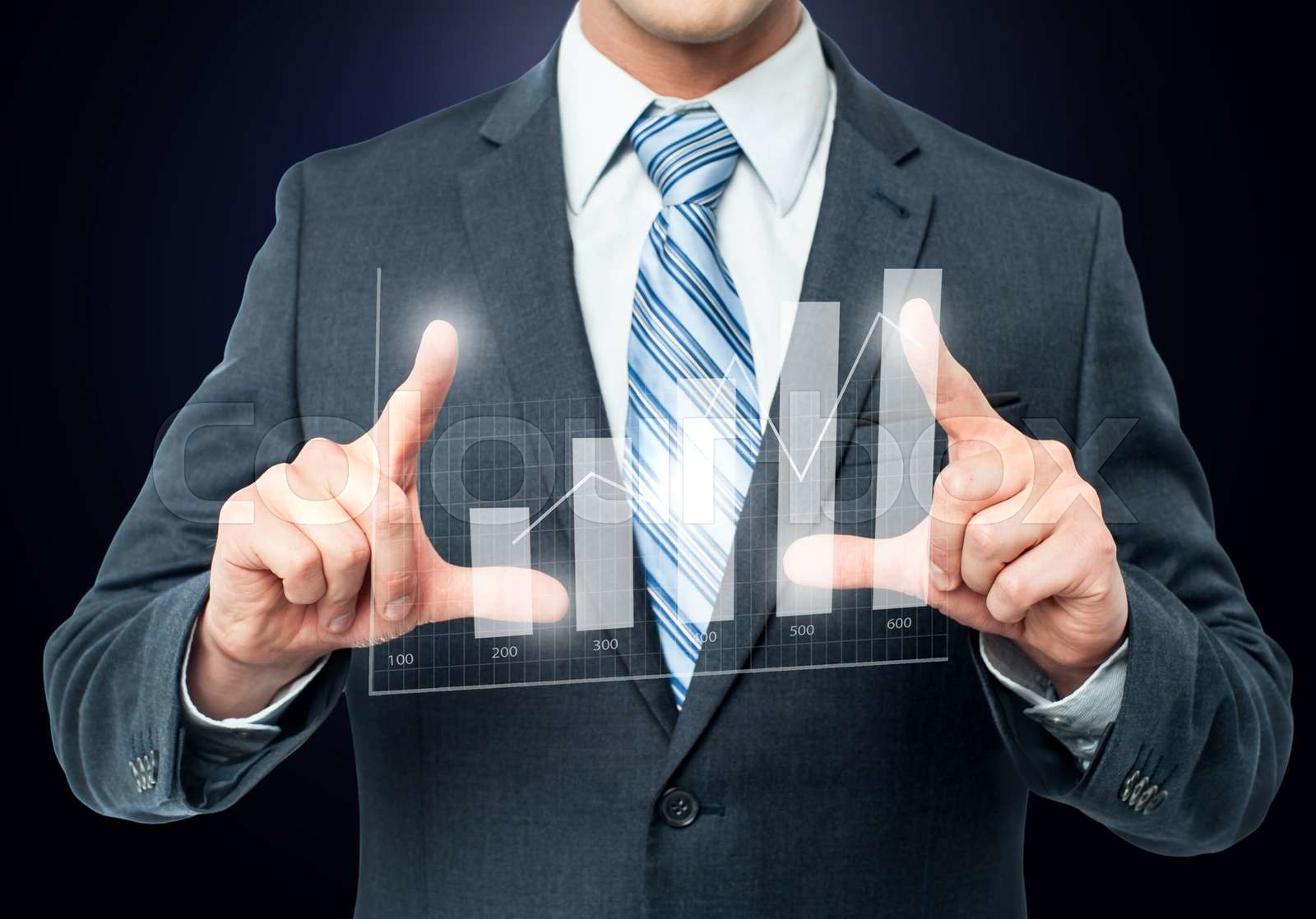 Businessman framing digital chart | Stock image | Colourbox